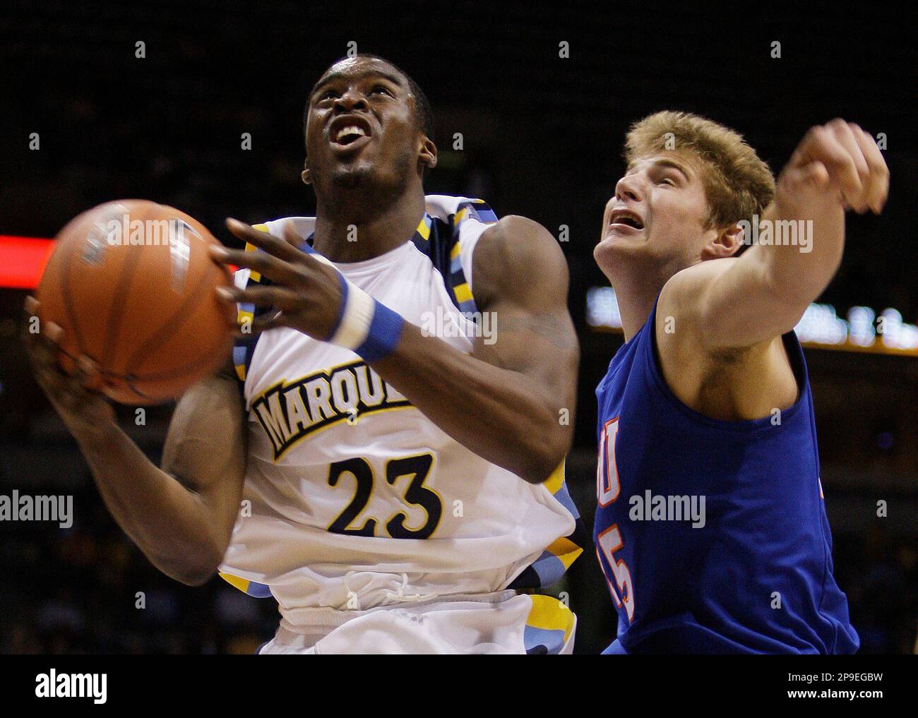 Marquette's Wesley Matthews (23) is fouled by Houston Baptist's Mario ...