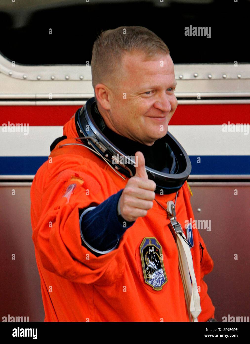 Space shuttle Endeavour pilot Eric Boe gives the thumbs up sign as he ...