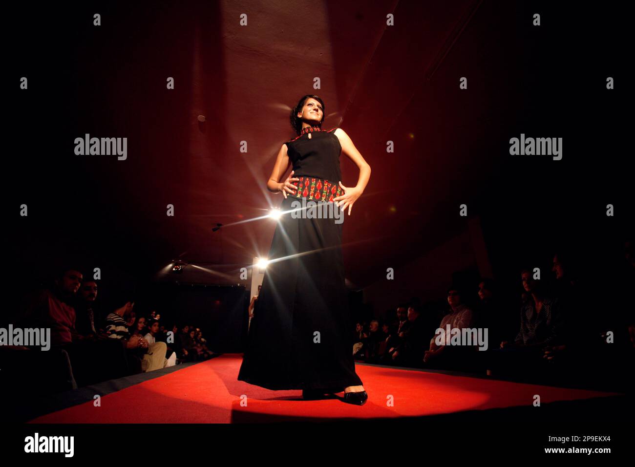 A Palestinian model wears a creation by young Palestinian fashion ...