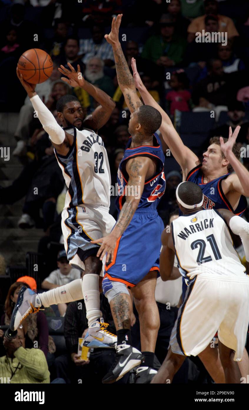 Memphis Grizzlies guard O.J. Mayo (32) passes under the double team ...