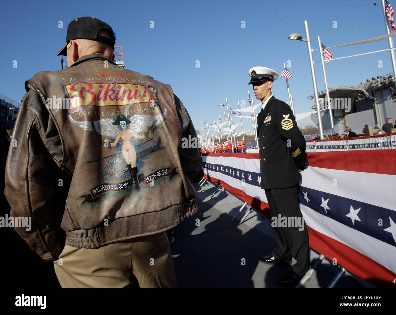 Vietnam veteran Russ Mowry, left, of Candia, N.H., wears his hand ...