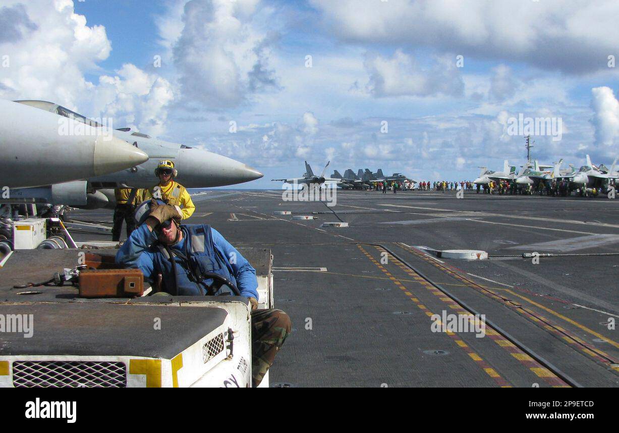**ADVANCE FOR SUNDAY, NOV. 16** An F-18 Hornet, center, is seen landed ...