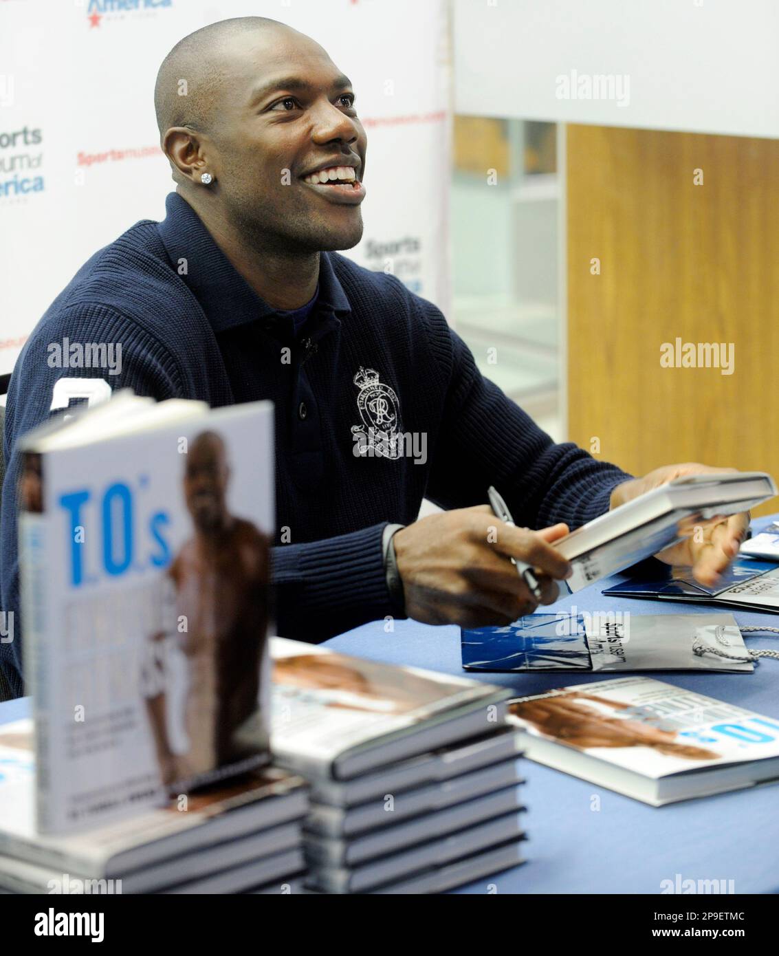 Dallas Cowboys football player Terrell Owens signs copies of his latest ...