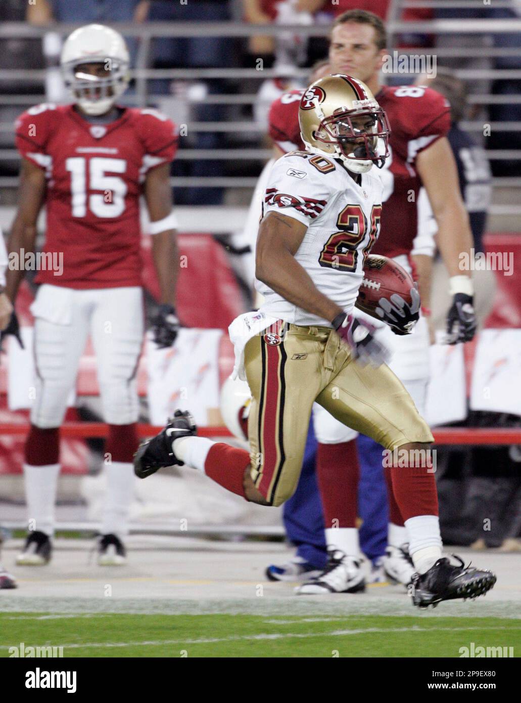 San Francisco 49ers' Allen Rossum runs back the game-opening kickoff ...