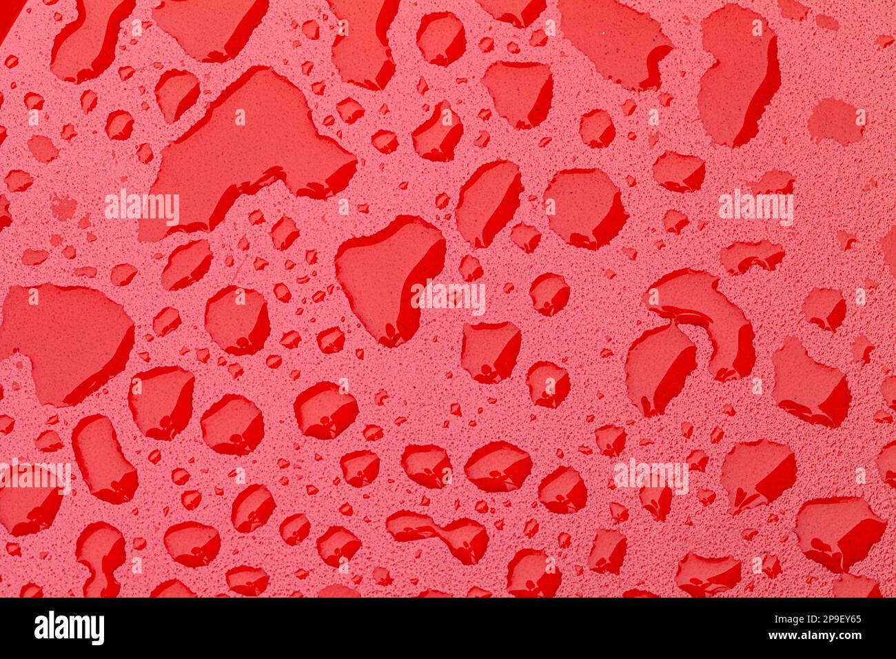 Red raindrops on a plastic surface Stock Photo - Alamy