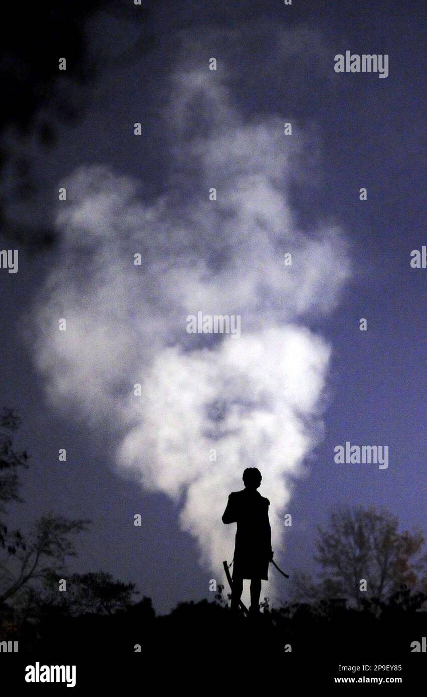 A column of steam rises behind the silhouetted statue of Revolutionary ...