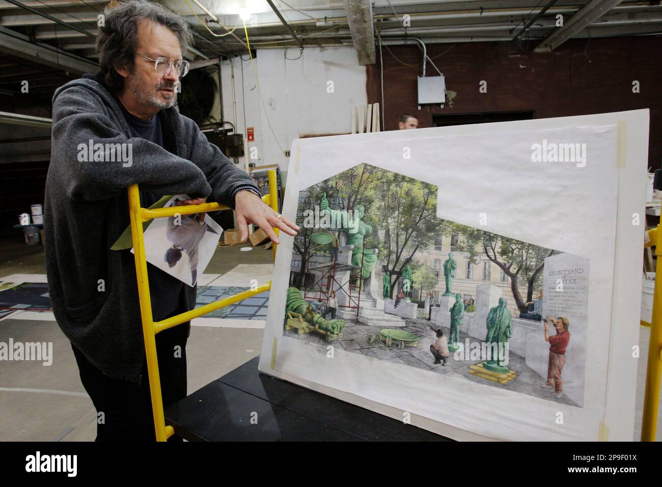 Mural artist Michael Webb is seen during an interview with the ...