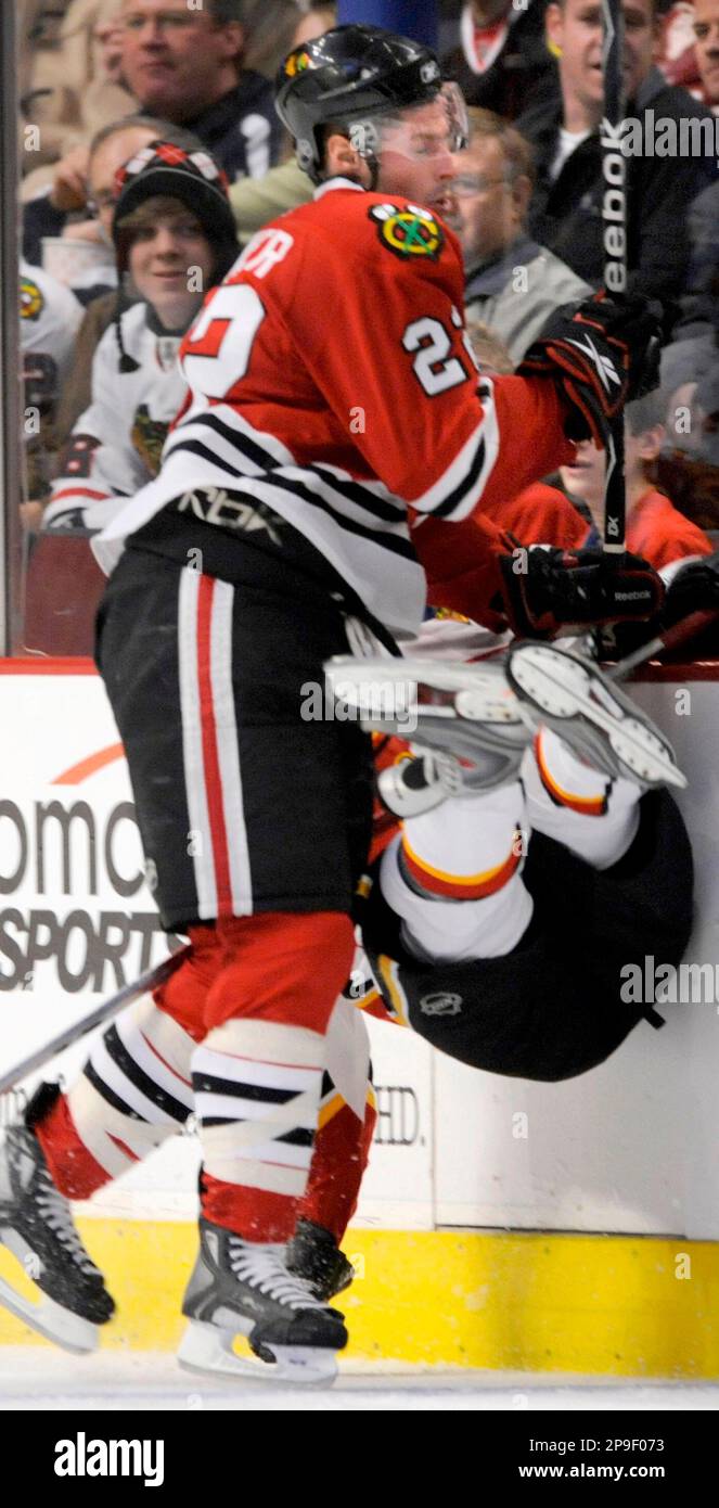 Chicago Blackhawks' Troy Brouwer right, checks Calgary Flames' Jim ...