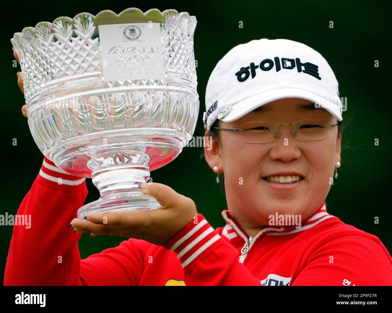Shin Ji-yai of South Korea wears a smile as she proudly shows off her ...