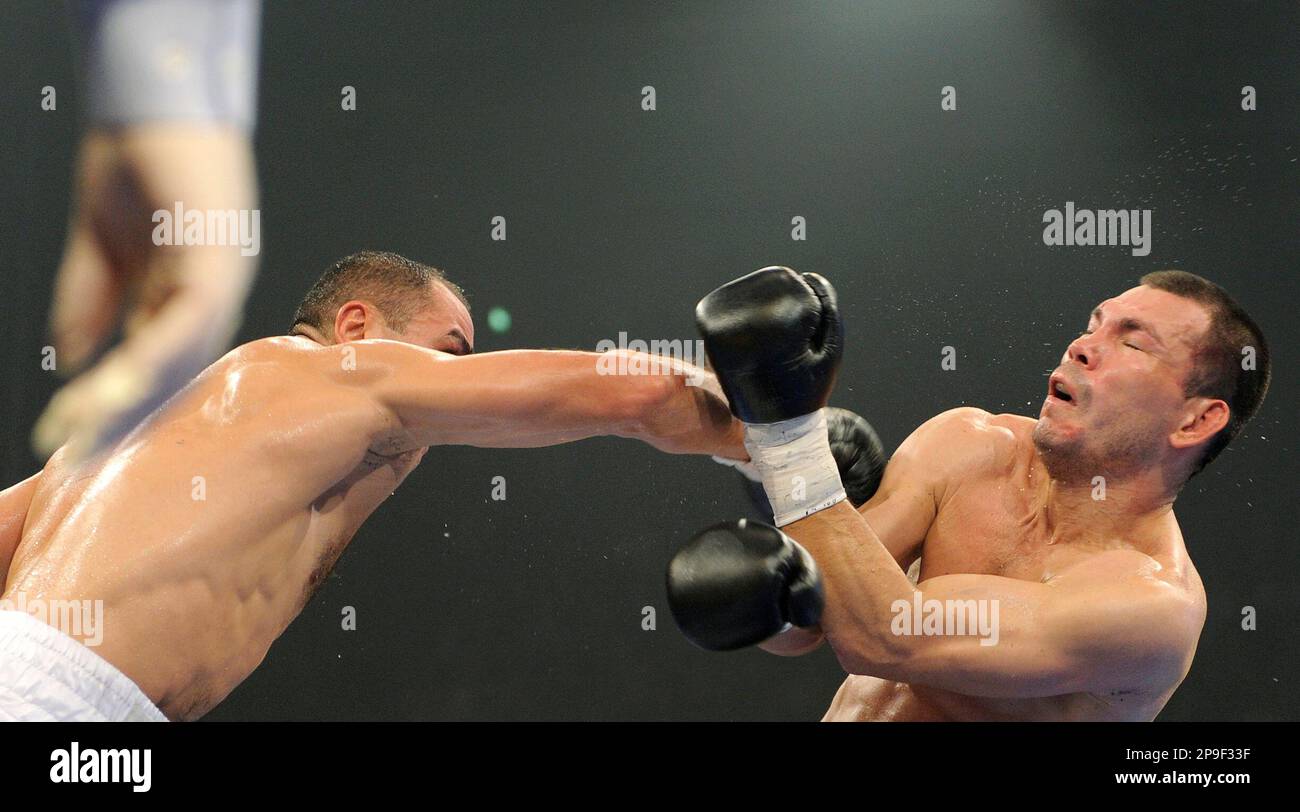 German boxer Arthur Abraham, left, punches American Raul Marquez during ...
