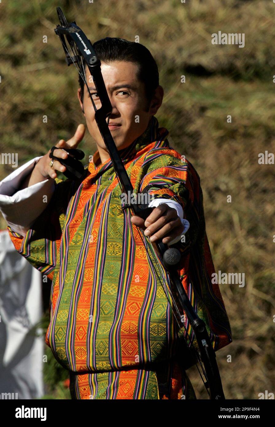Bhutan's fifth King Jigme Khesar Namgyal Wangchuk follows an arrow ...