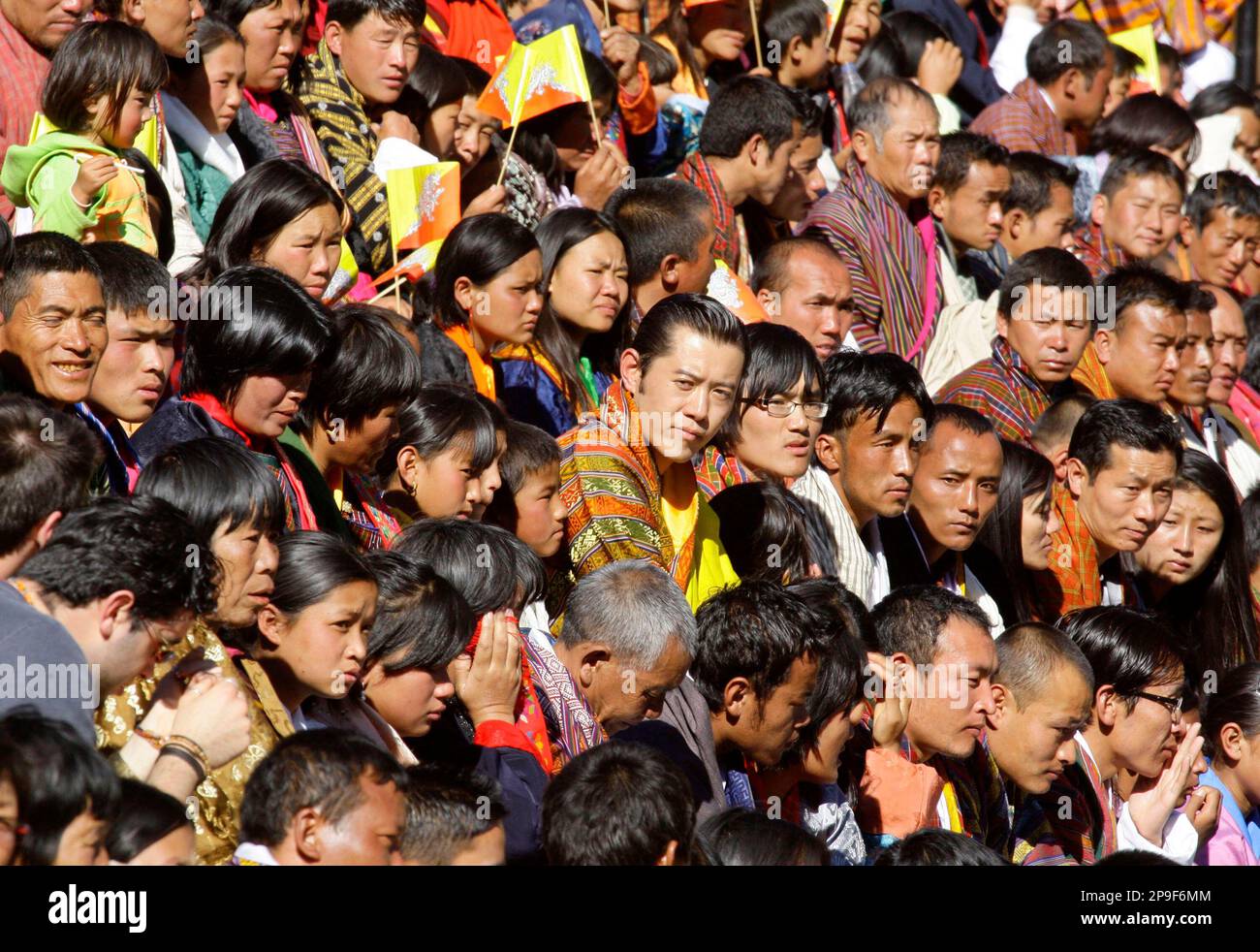 Bhutan's fifth King Jigme Khesar Namgyal Wangchuk, 28, center in yellow ...
