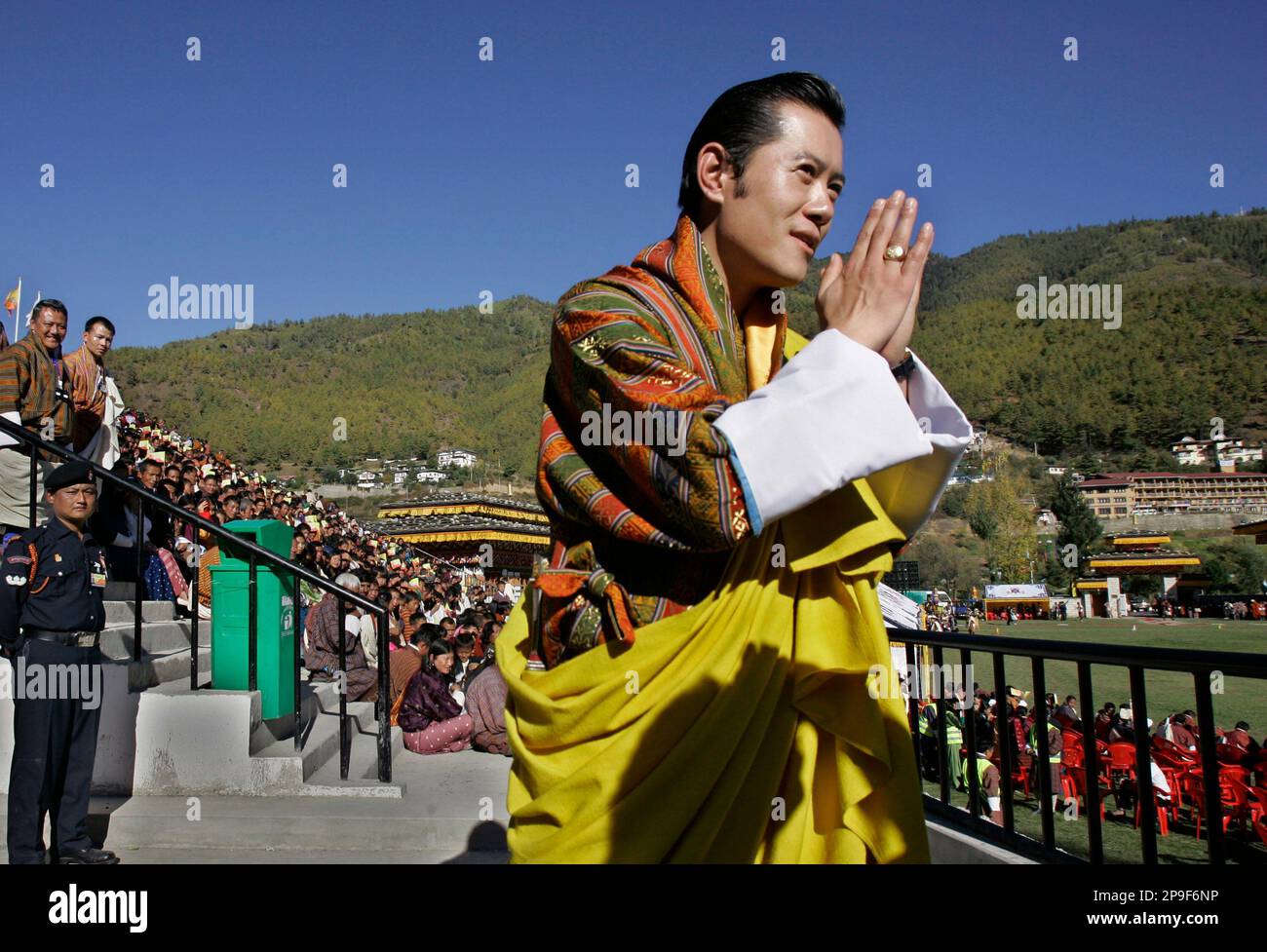 Bhutan's fifth King Jigme Khesar Namgyal Wangchuck, right, greets the ...