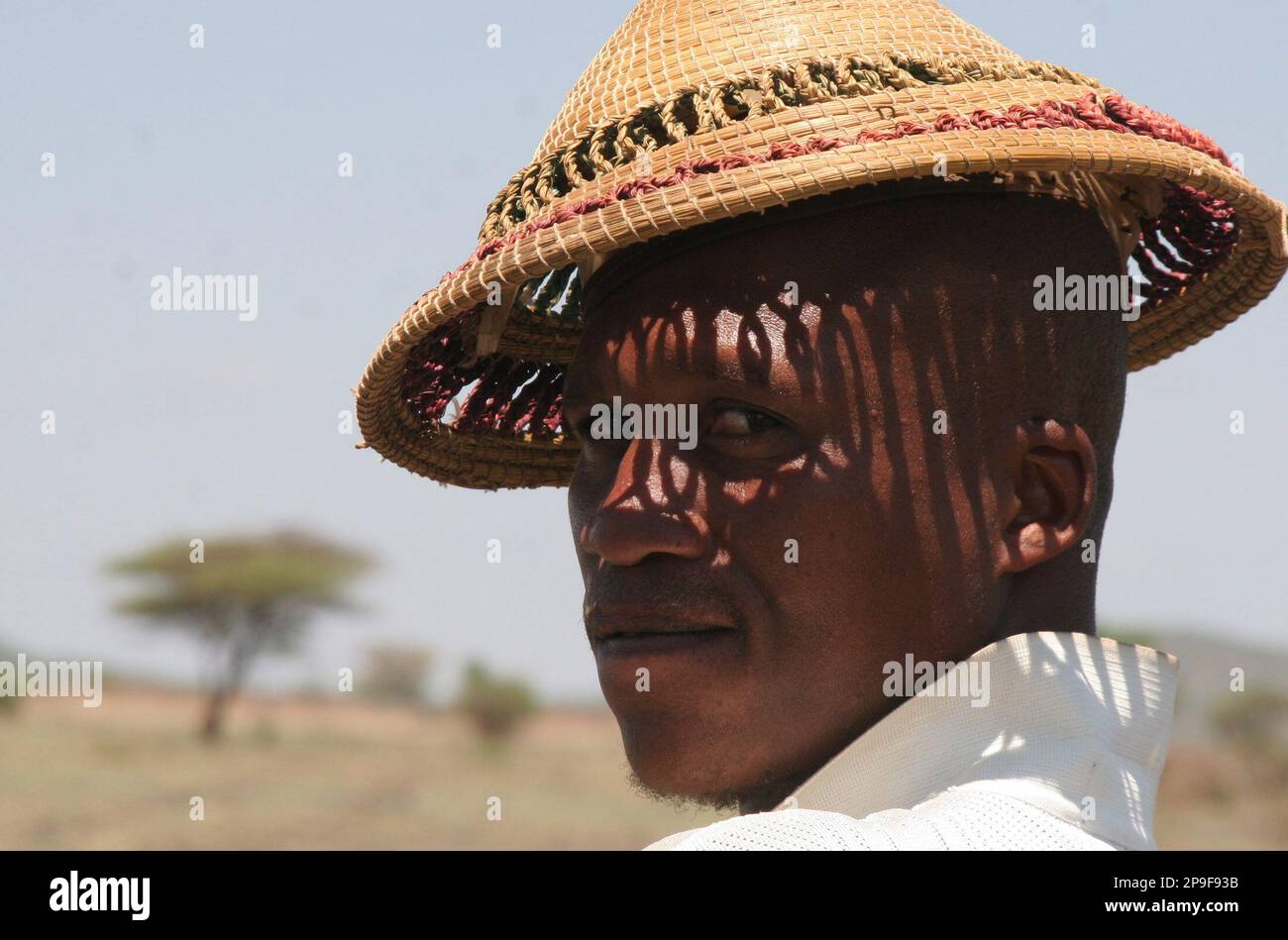 A job seeker observes a sod-turning event at the Bafokeng Rasimore ...