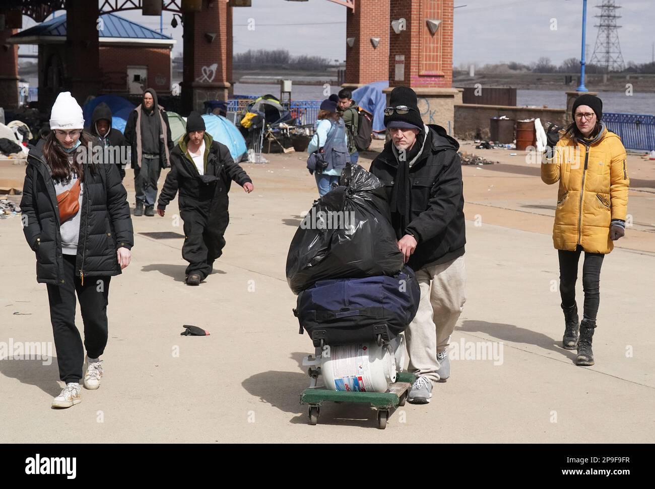 St. Louis, United States. 10th Mar, 2023. A homeless man pushes his ...