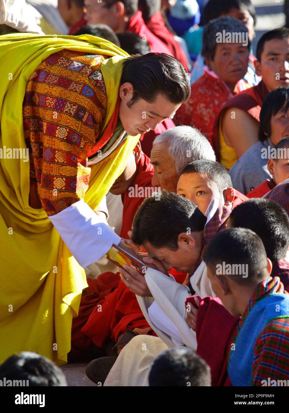 Bhutan's 5th King Jigme Khesar Namgyal Wangchuk, left, interacts with ...
