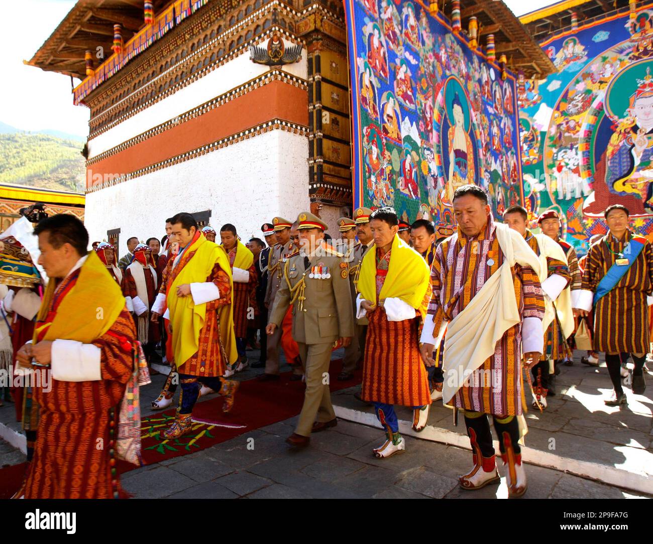 Bhutan's 5th King Jigme Khesar Namgyal Wangchuk, second left, arrives ...