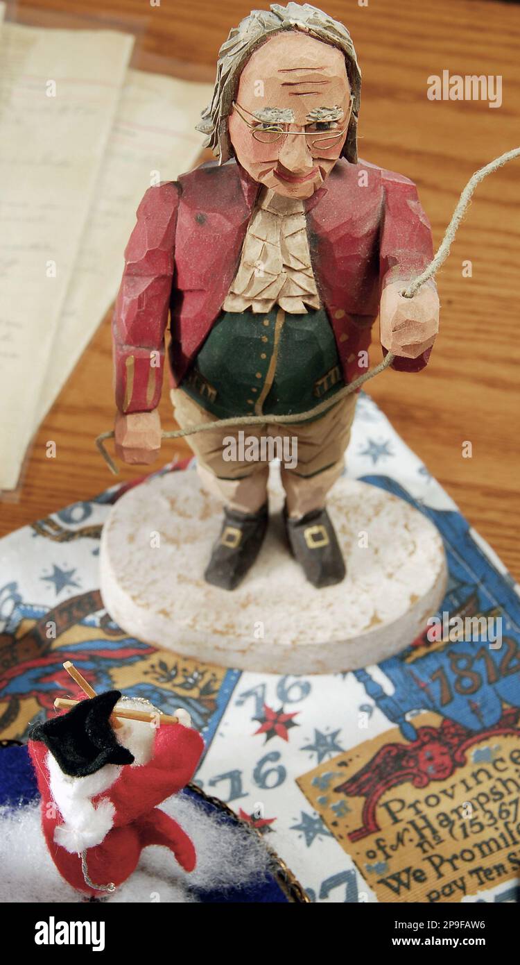 A wooden Benjamin Franklin statue from the collection of Joyce Snay is ...