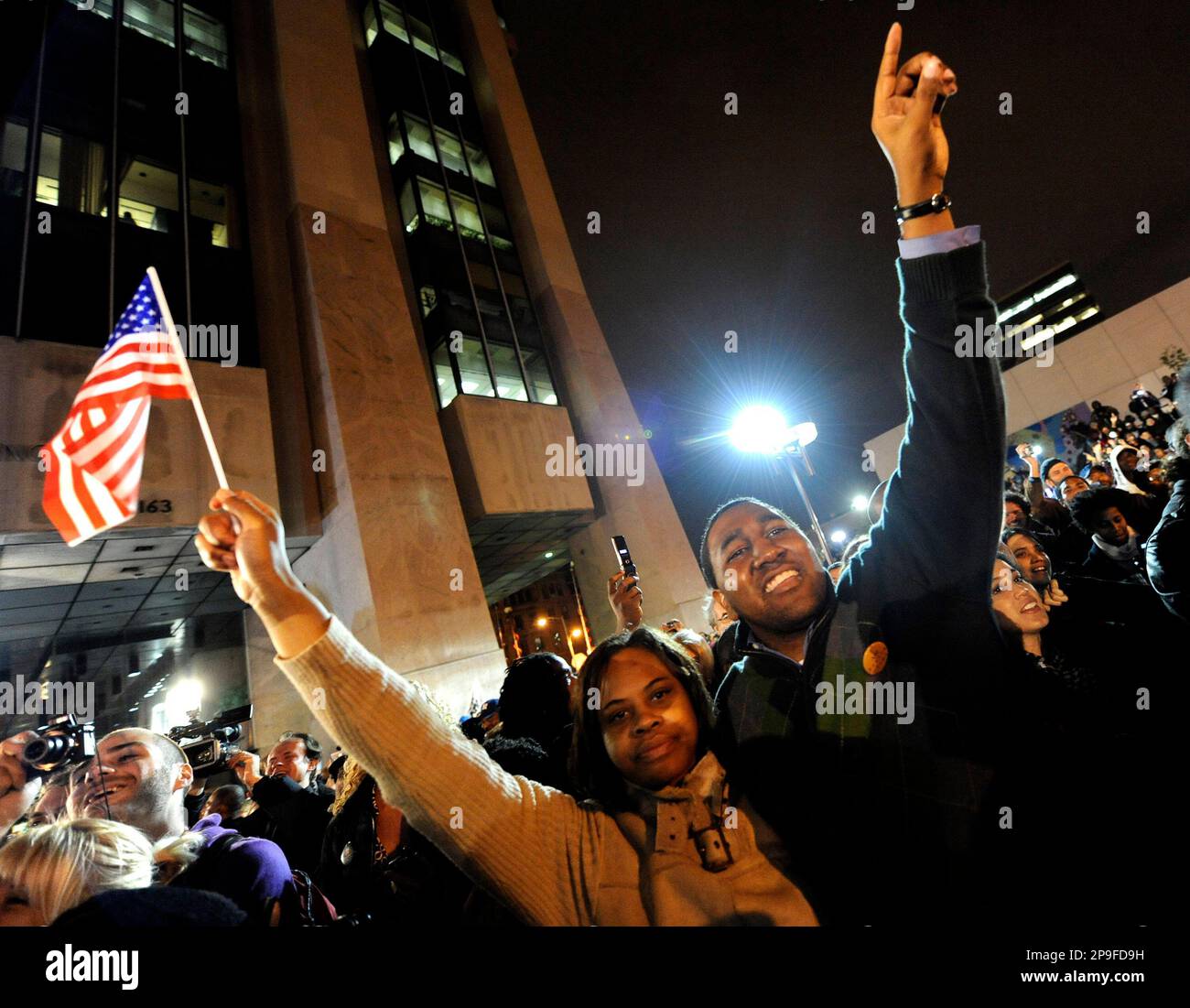 A couple celebrates after President-elect Barack Obama was projected ...