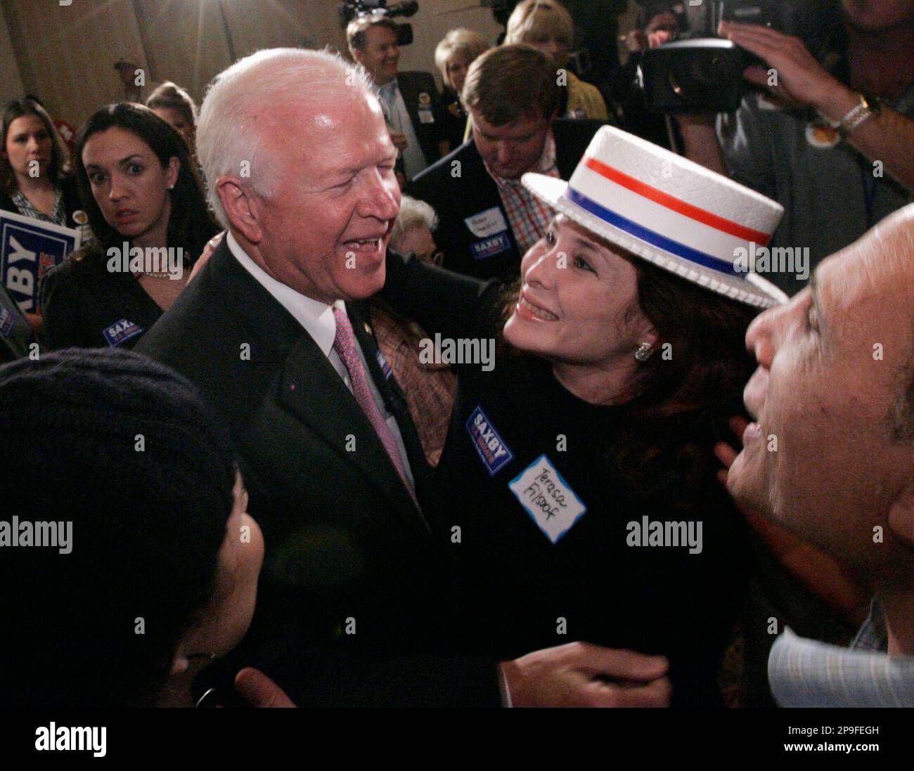 U.S. Sen. Saxby Chambliss, R-Ga., gets a hug from campaign volunteer ...