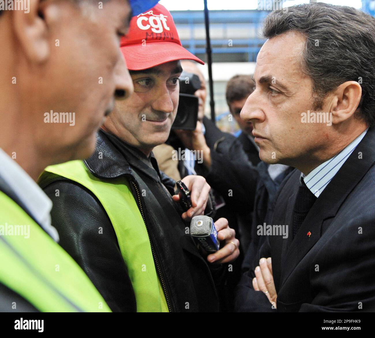 French President Nicolas Sarkozy, right, meets union representatives ...