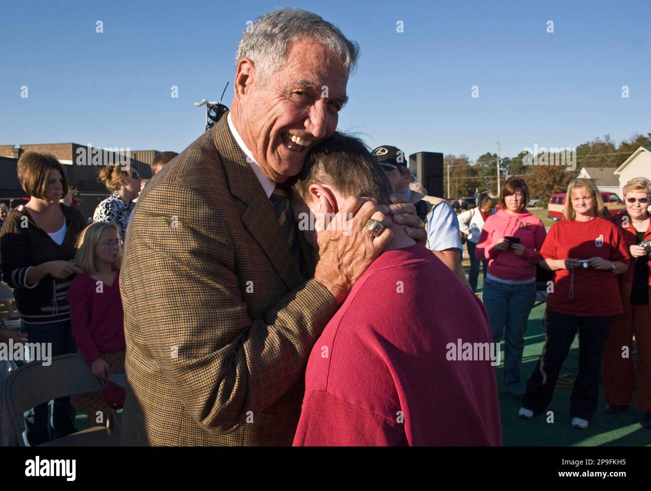 Former University of Alabama football coach Gene Stallings, left, hugs ...
