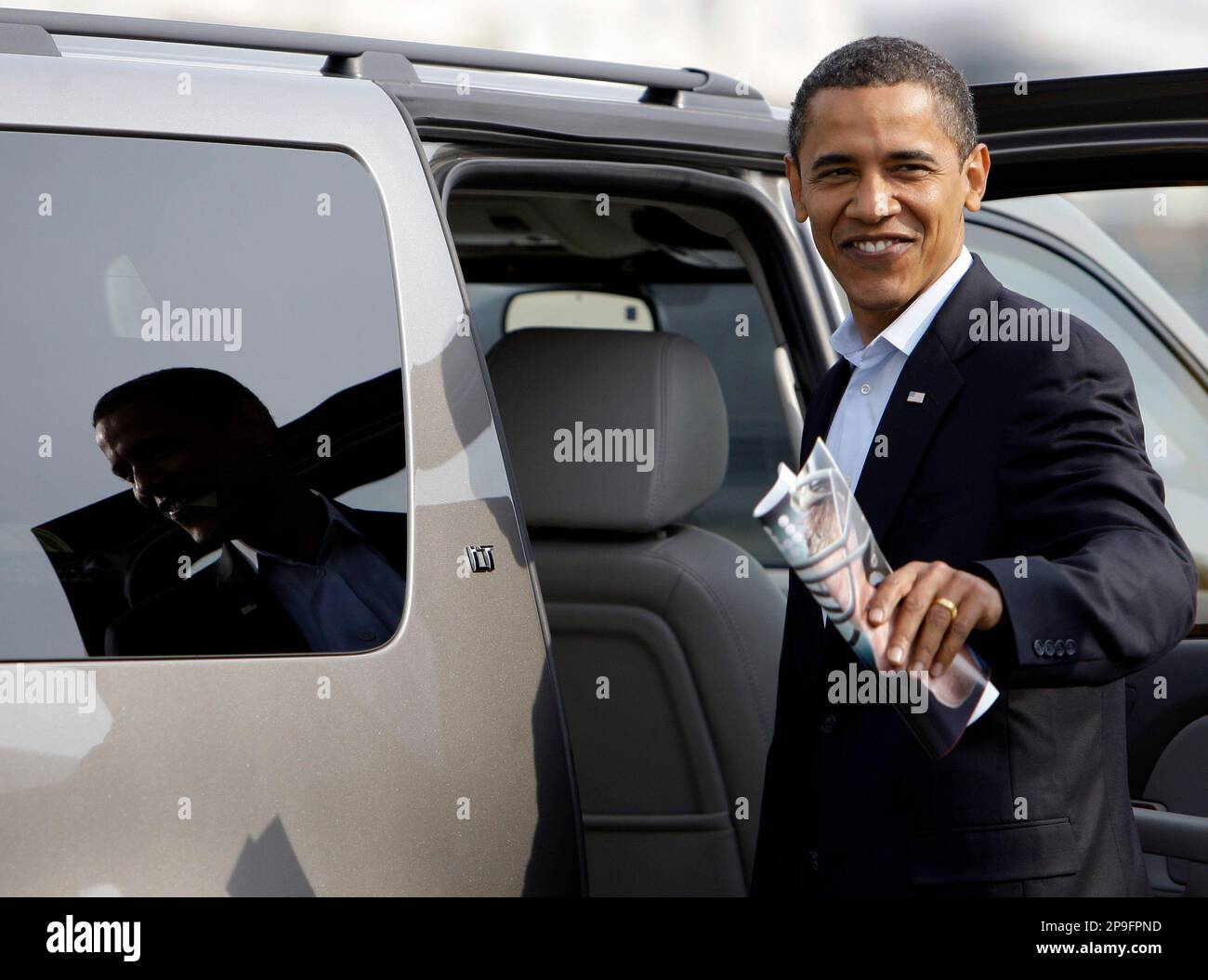 Democratic presidential candidate Sen. Barack Obama, D-Ill., waves on ...