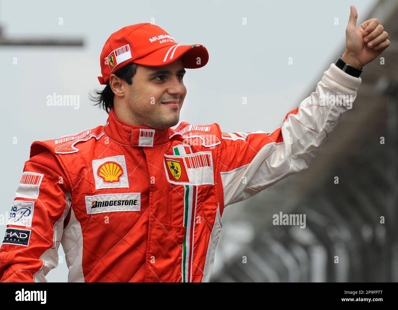 Ferrari's Formula One driver Felipe Massa, of Brazil, waves to fans ...