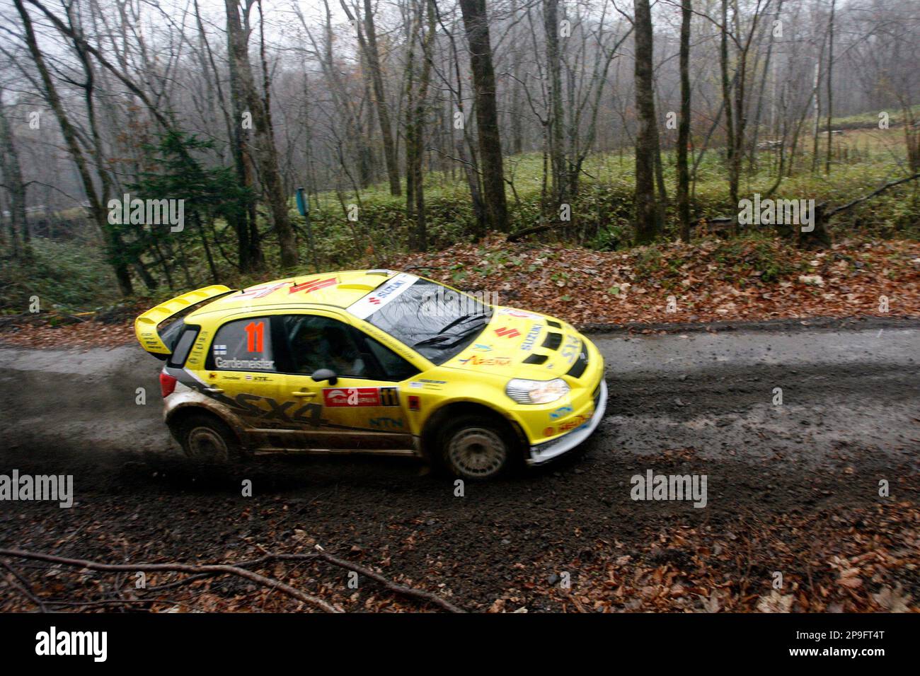 Finland's Toni Gardemeister of Suzuki races during the Rally Japan in ...
