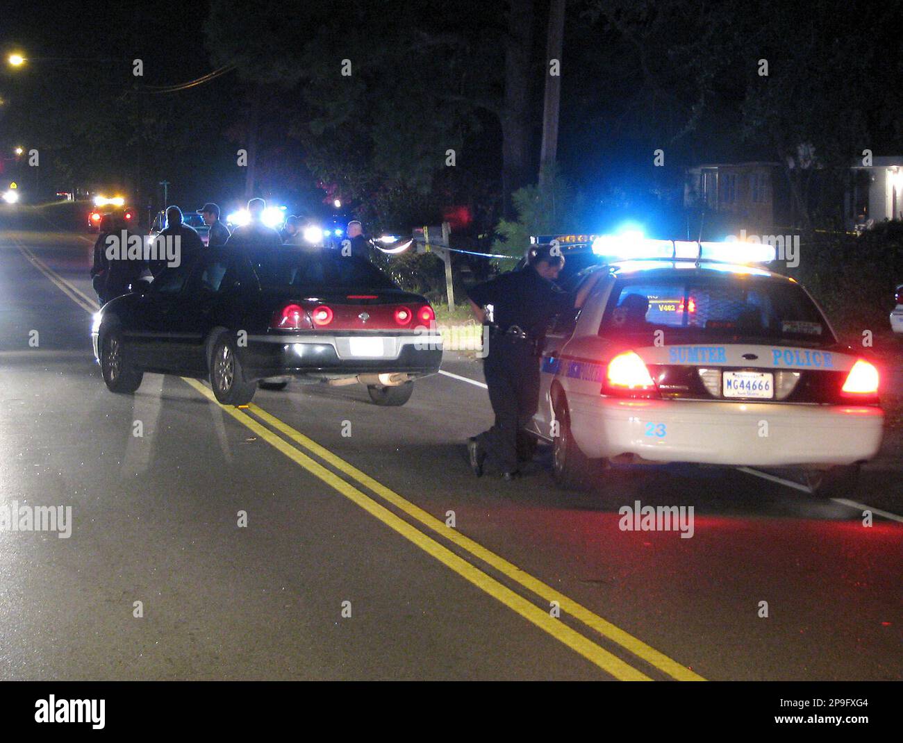 Officers from the Sumter Police Department converge on the scene of a ...