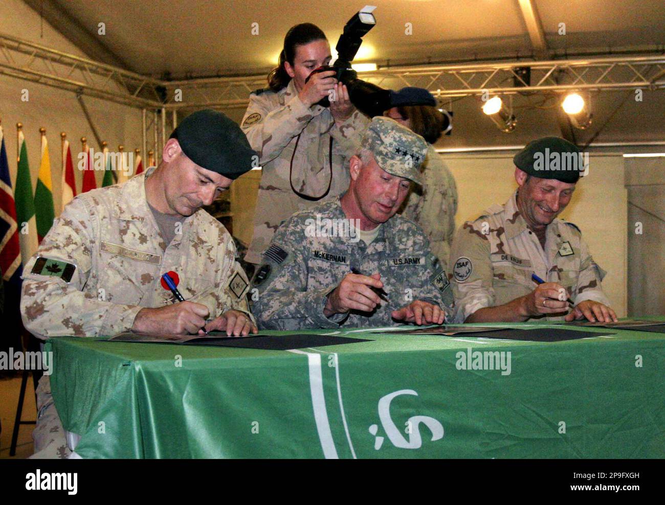 From left to right, the out going NATO commander of Regional Command ...