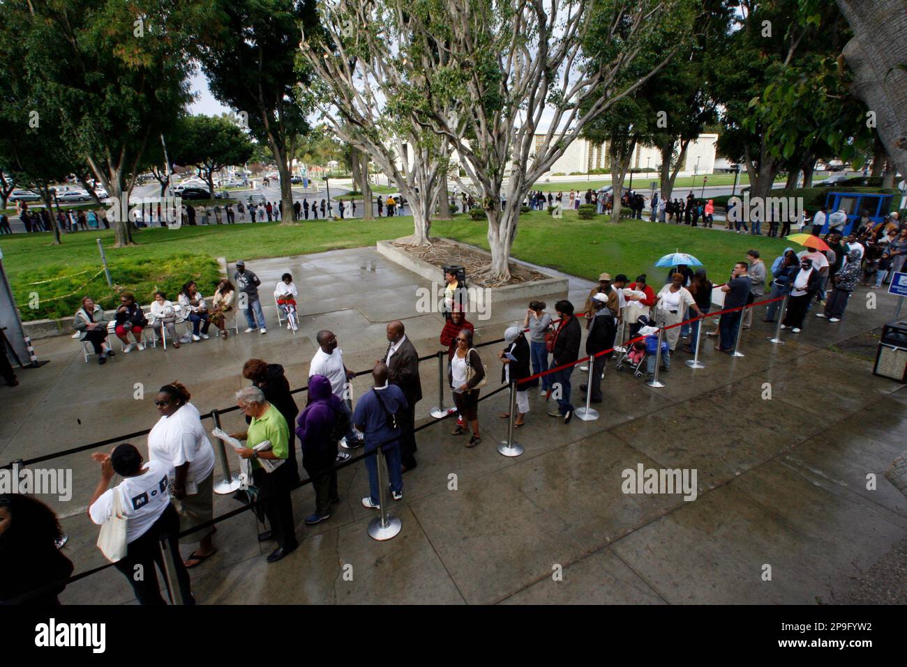 A long line of early voters line up to cast their ballots at the Los ...