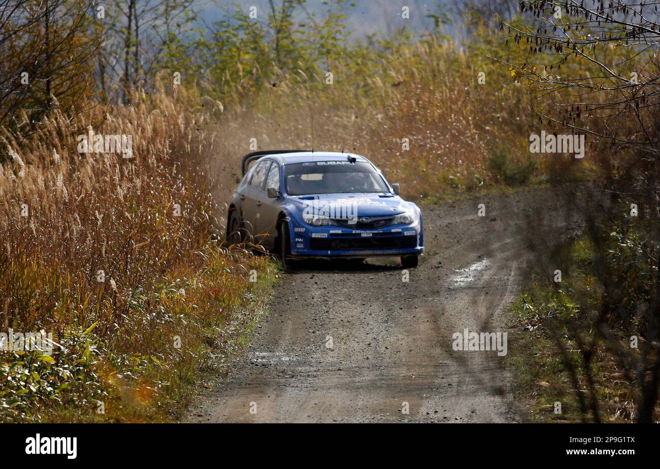 Australia's Chris Atkinson of Subaru races in the wood during the Rally ...