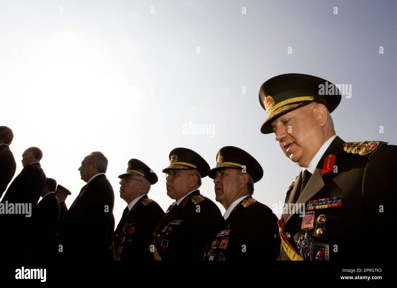 Turkish army's top generals follow Prime Minister Tayyip Erdogan, left ...