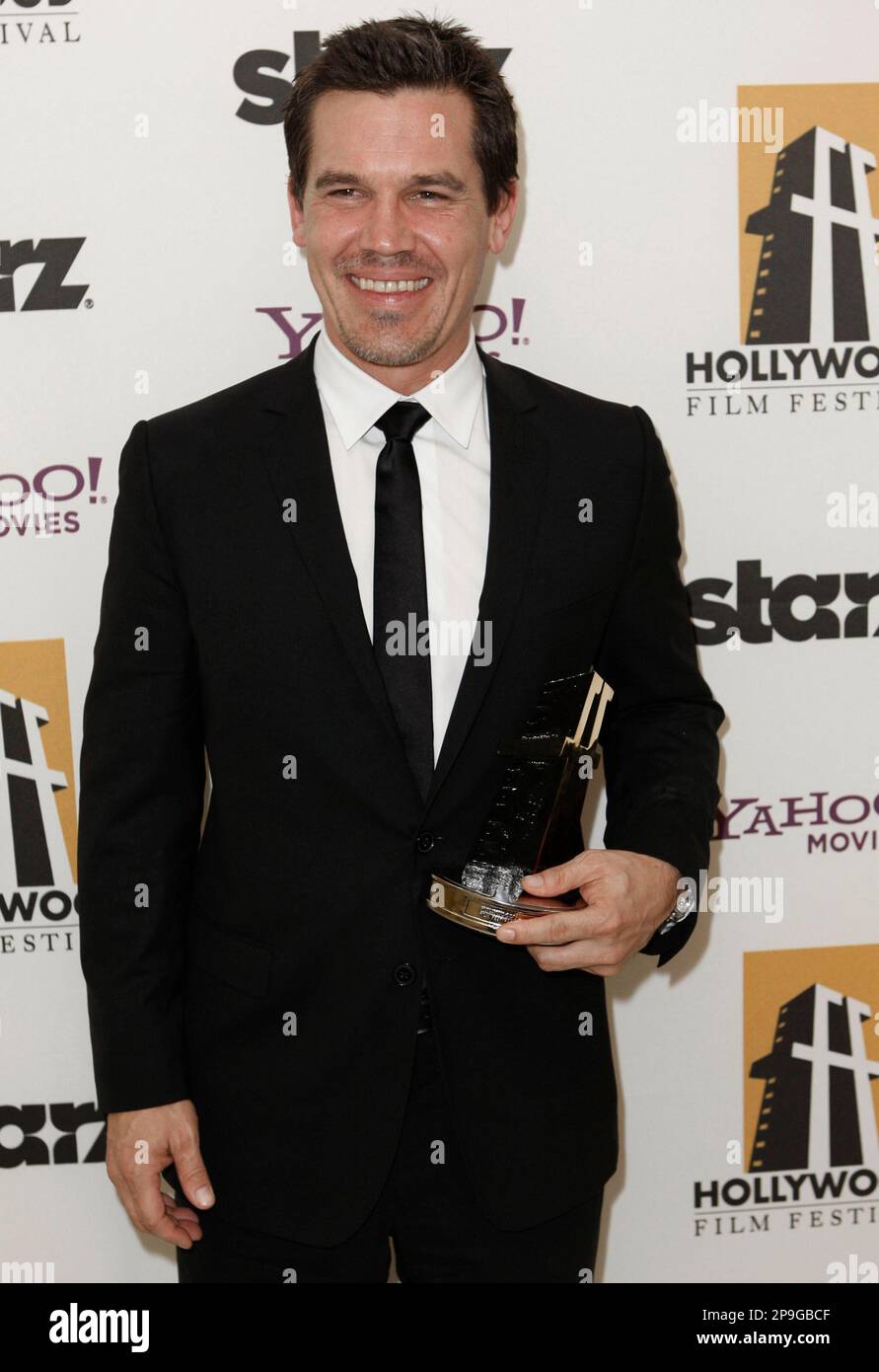Actor Josh Brolin holds his actor of the year award backstage at the ...