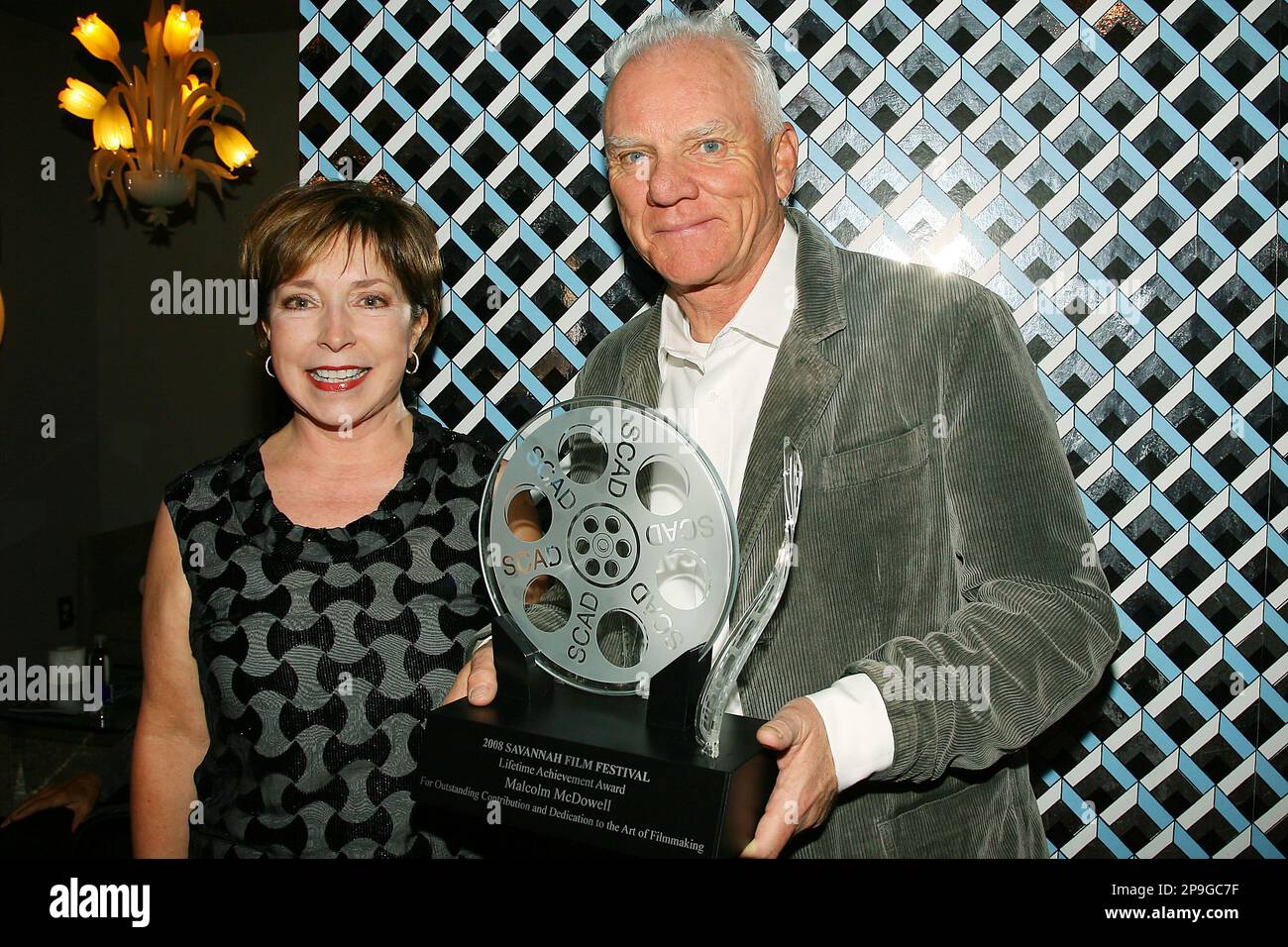 In this photo provided by StarPix, actor Malcolm McDowell poses with ...