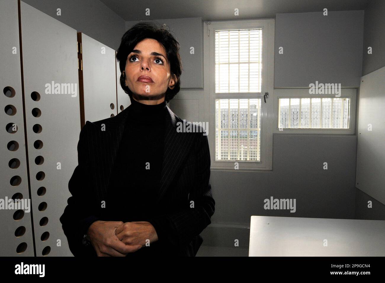 French Justice Minister Rachida Dati visits a cell as she walks through ...
