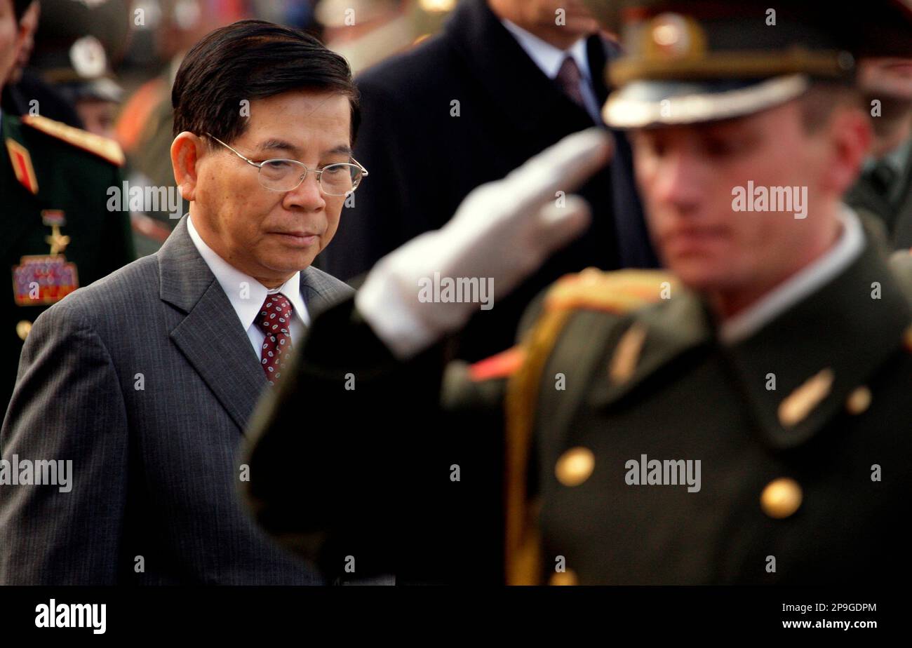Vietnamese President Nguyen Minh Triet, left, attends a wreath laying ...