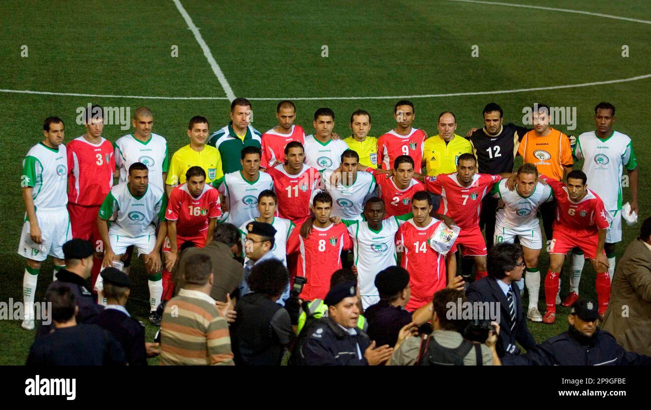 Palestinian and Jordanian players gather together to pose for a picture ...