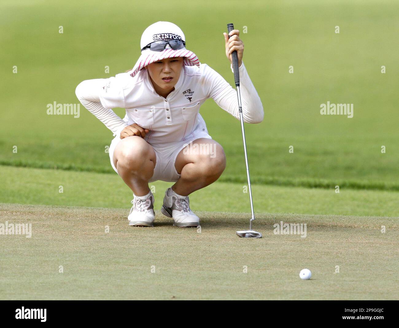 South Korea's Young Kim lines up a putt at the Grand China Air LPGA ...