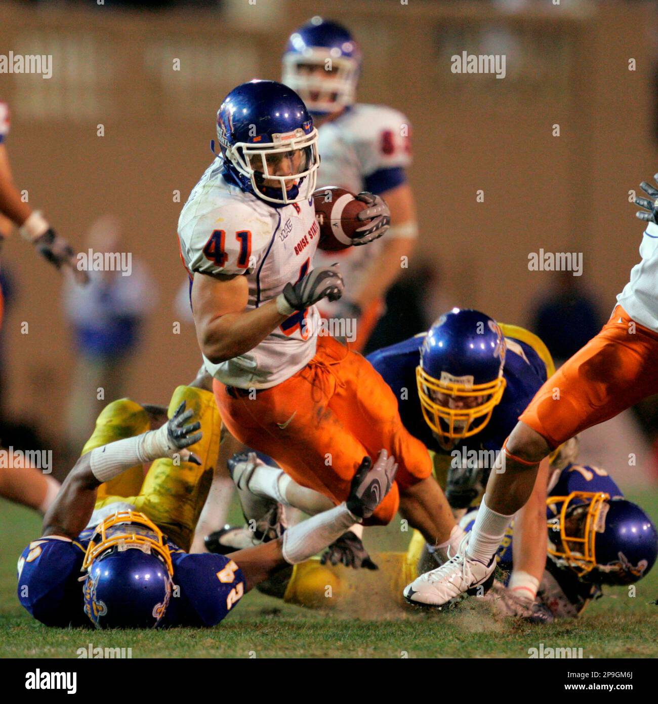 Boise State running back Ian Johnson, center, runs past San Jose State ...