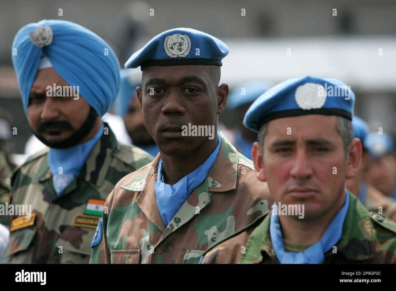 An Indian soldier, left, a South African soldier, center , and a ...