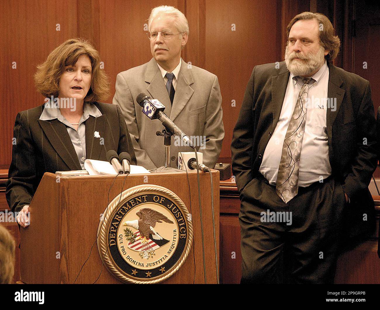 Acting U.S. Attorney Julia Dudley announces a 22-count indictment ...