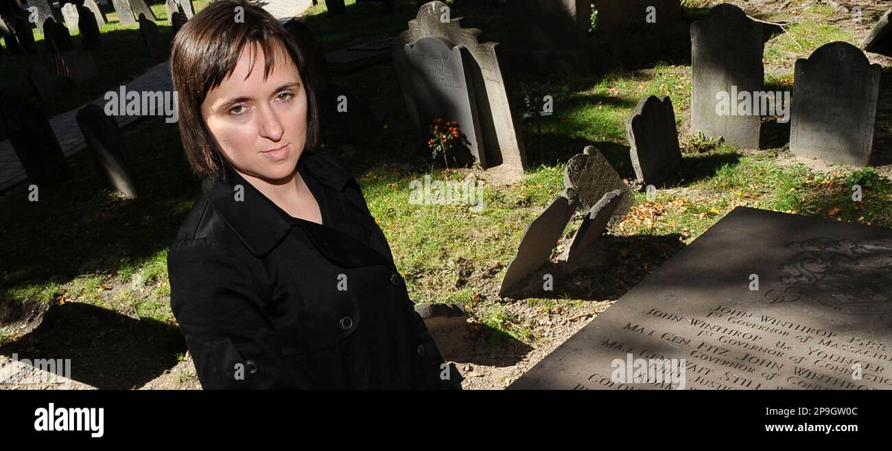 Author Sarah Vowell poses next to Gov. John Winthrop's tomb, right, at ...
