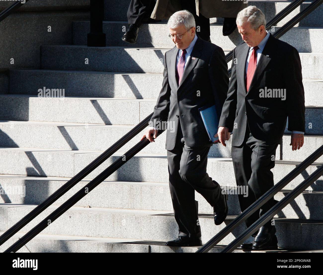 President Bush walks with his Chief of Staff Joshua Bolten, left, after ...