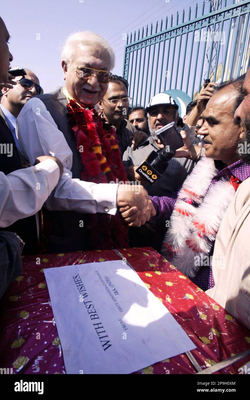 President of Pakistan-administered Kashmir, Raja Zulqarnain Khan shakes ...