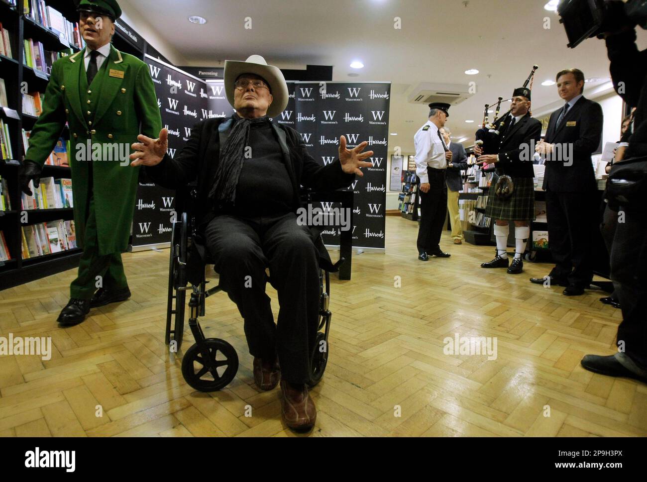 US actor Tony Curtis, right, poses for photographs before signing ...
