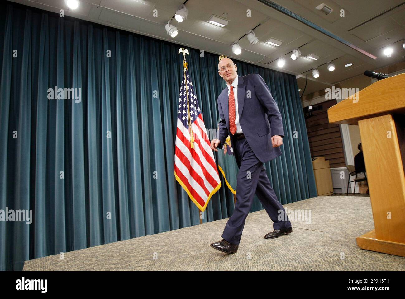 Treasury Secretary Henry Paulson leaves the podium after making a ...