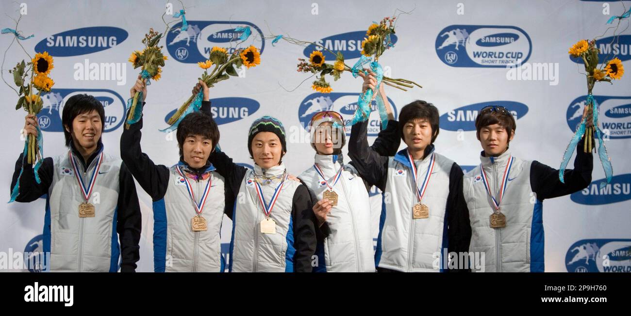 South Korean skaters stand on the podium after winning the 5,000 relay ...
