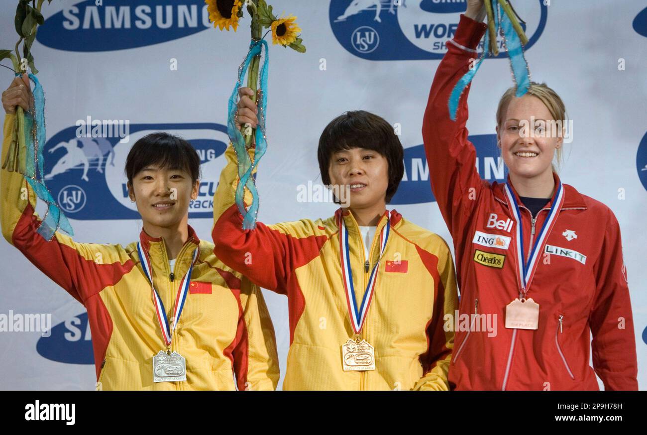 China's Liu Qiuhong, China's Wang Meng and Canada's Jessica Gregg, left ...